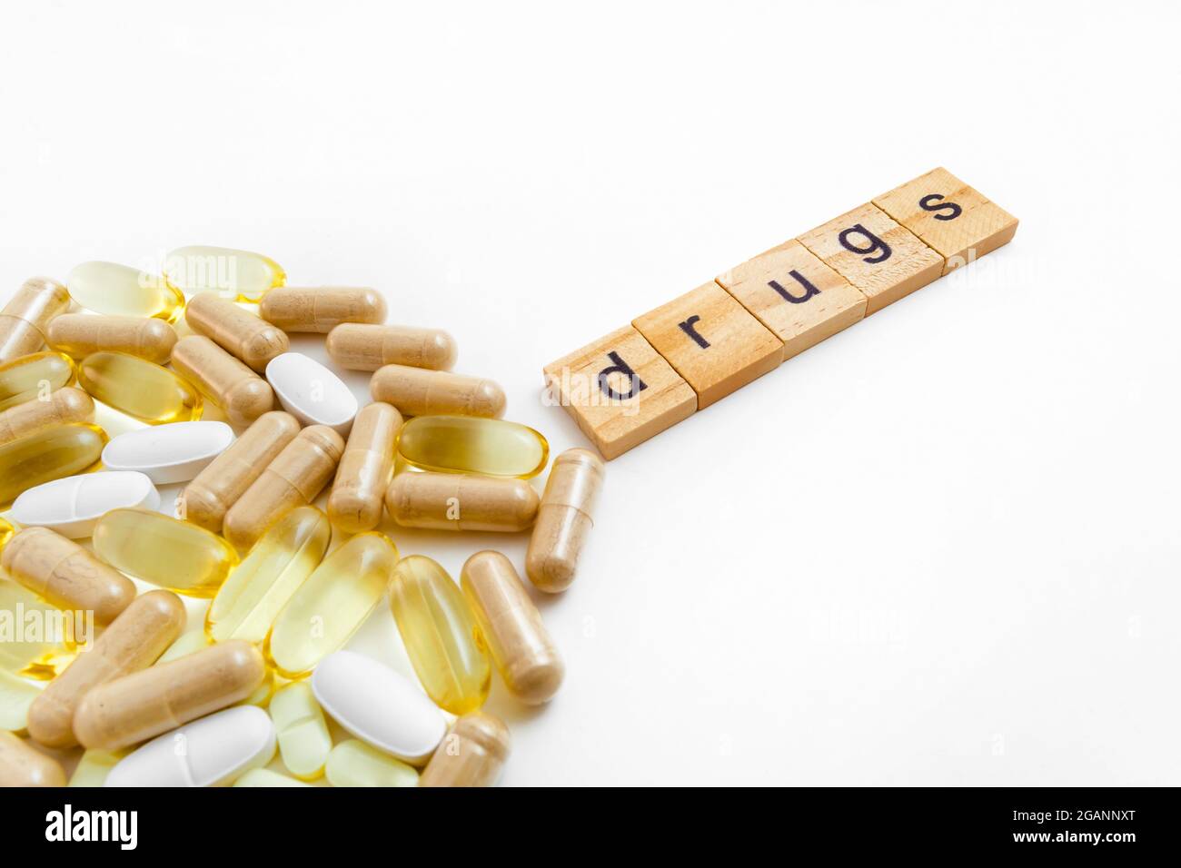 inscription DRUGS in wooden cubes on a white background of different ...