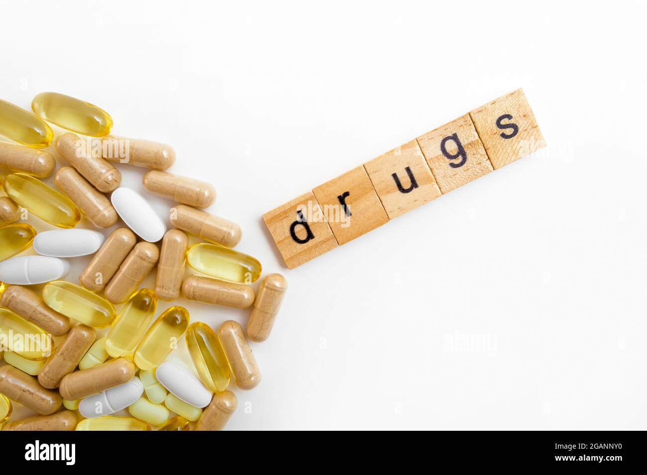 inscription DRUGS in wooden cubes on a white background of different ...