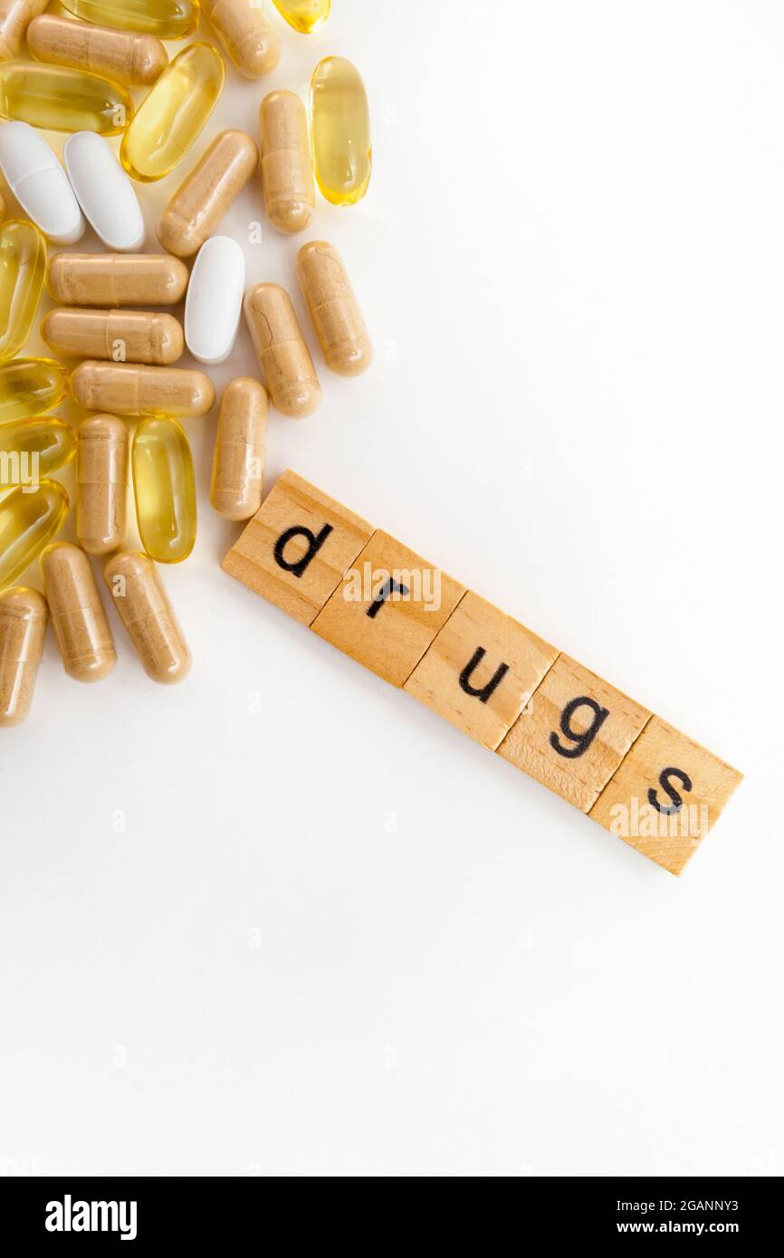 inscription DRUGS in wooden cubes on a white background of different ...