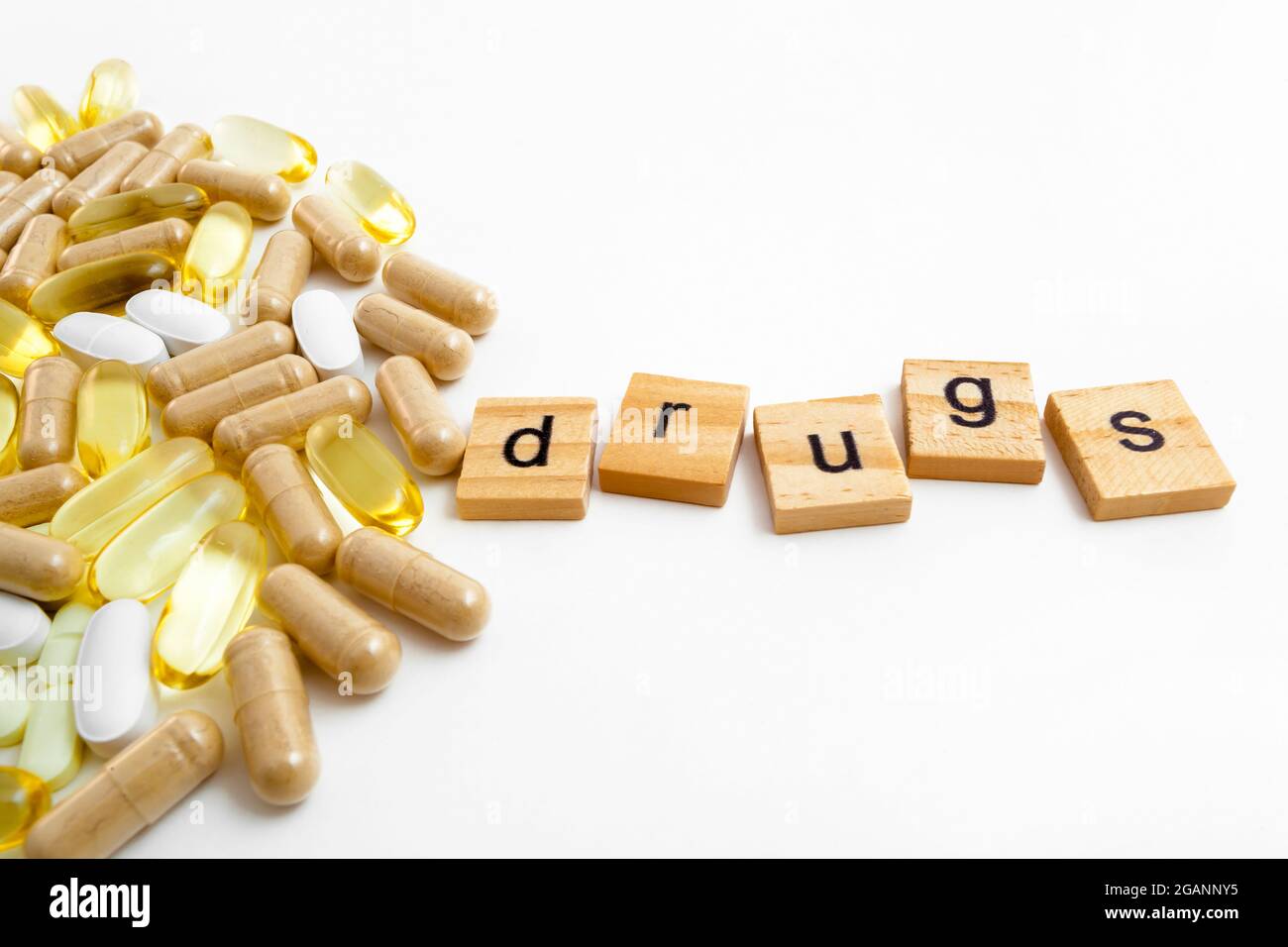 inscription DRUGS in wooden cubes on a white background of different ...