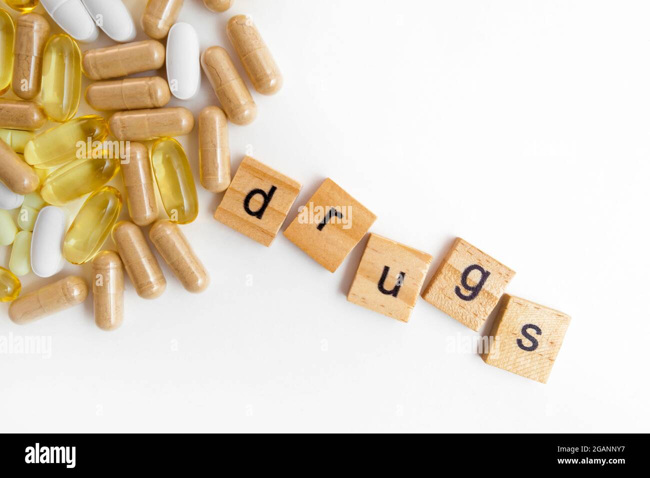 inscription DRUGS in wooden cubes on a white background of different ...