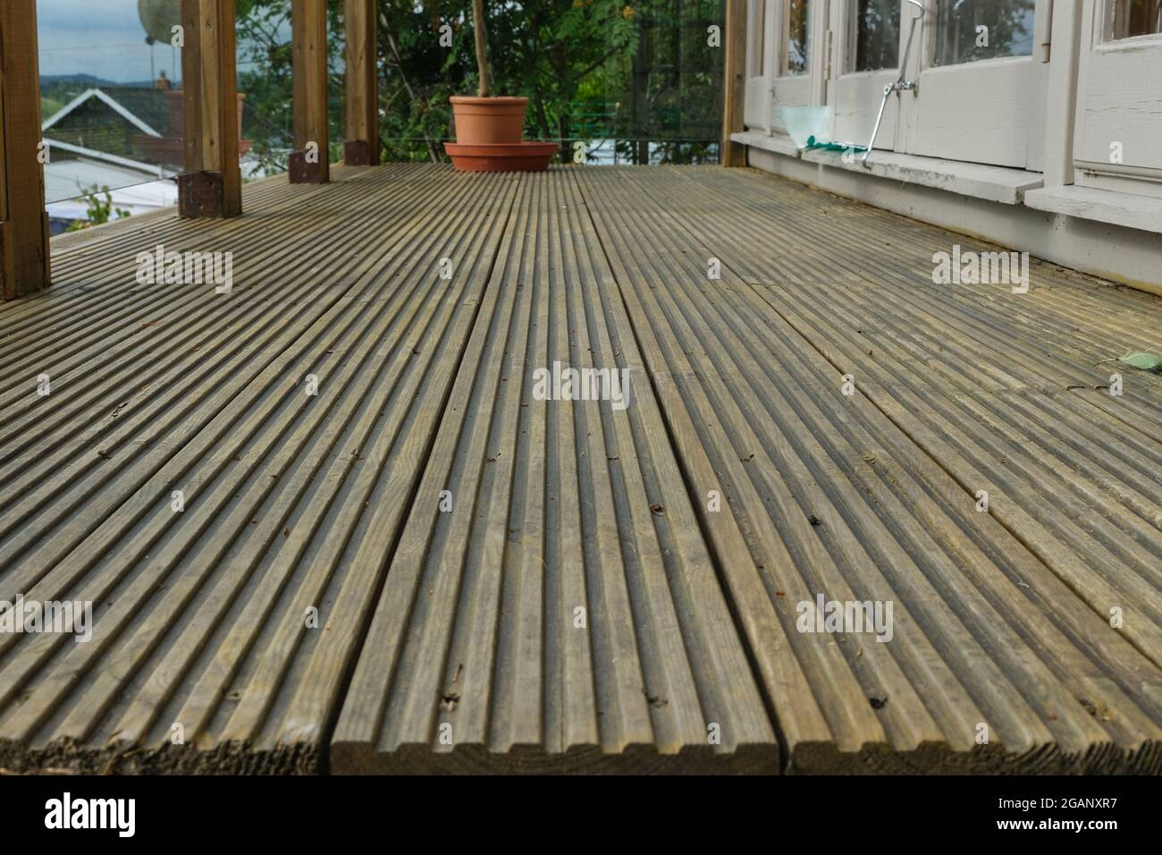 Close up of grooved wooden garden decking boards Stock Photo - Alamy