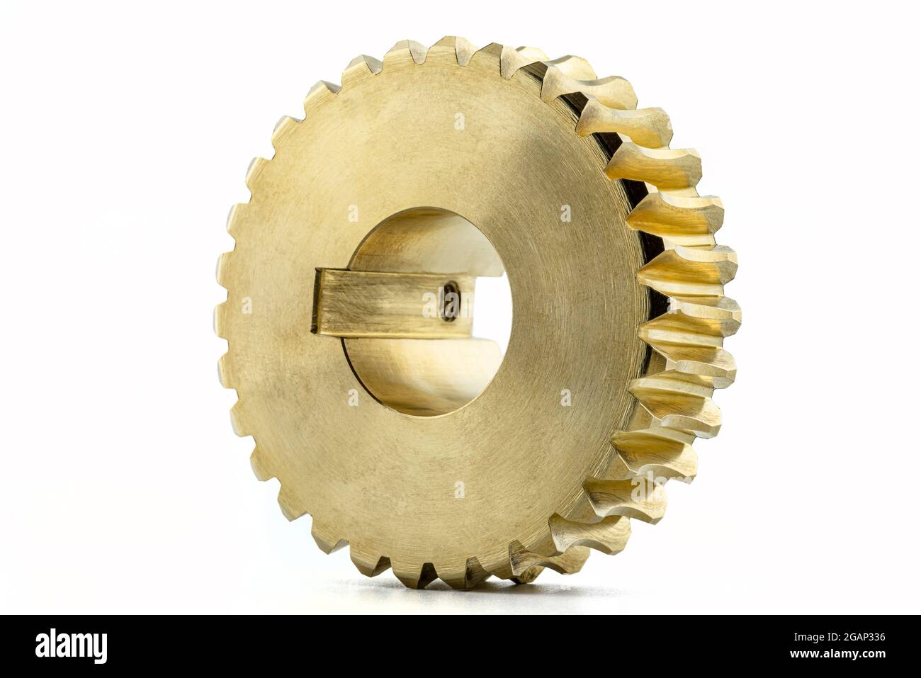 A macro photo of a new shiny copper gear, isolated on a white ...