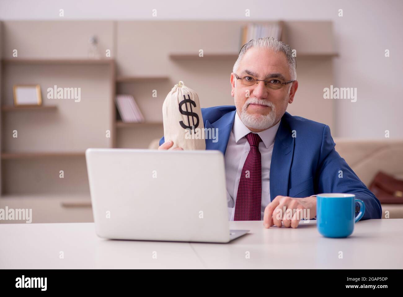 Old employee working from home during pandemic Stock Photo - Alamy