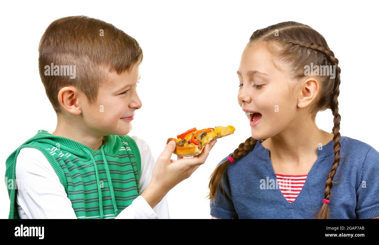 Children eating pizza isolated on white Stock Photo - Alamy