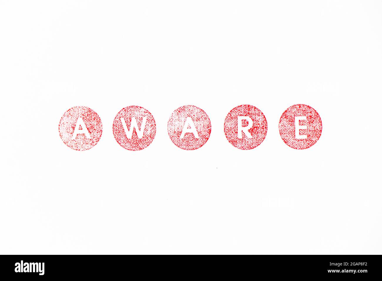 Red color rubber stamp in word aware on white paper background Stock ...