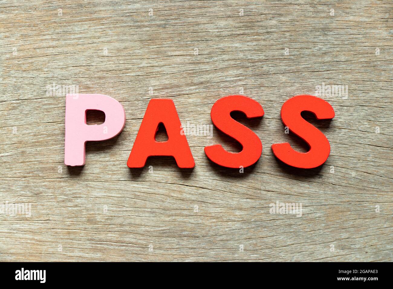 Color alphabet letter in word pass on wood background Stock Photo - Alamy