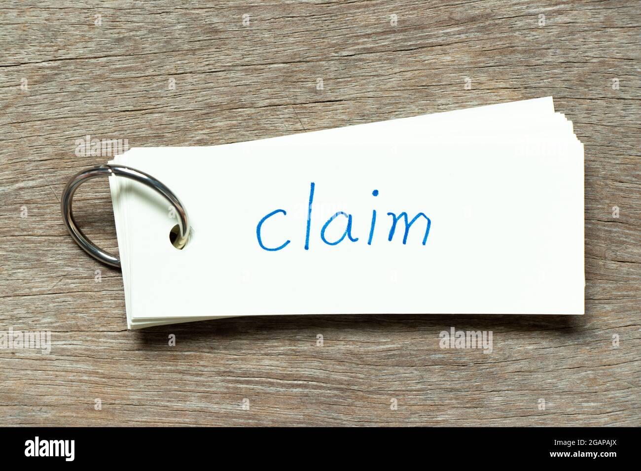 Flash card with handwriting word claim on wood background Stock Photo ...