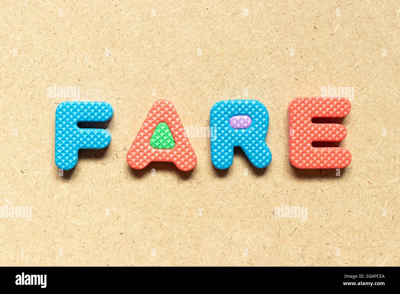 Foam alphabet letter in word fare on wood background Stock Photo - Alamy