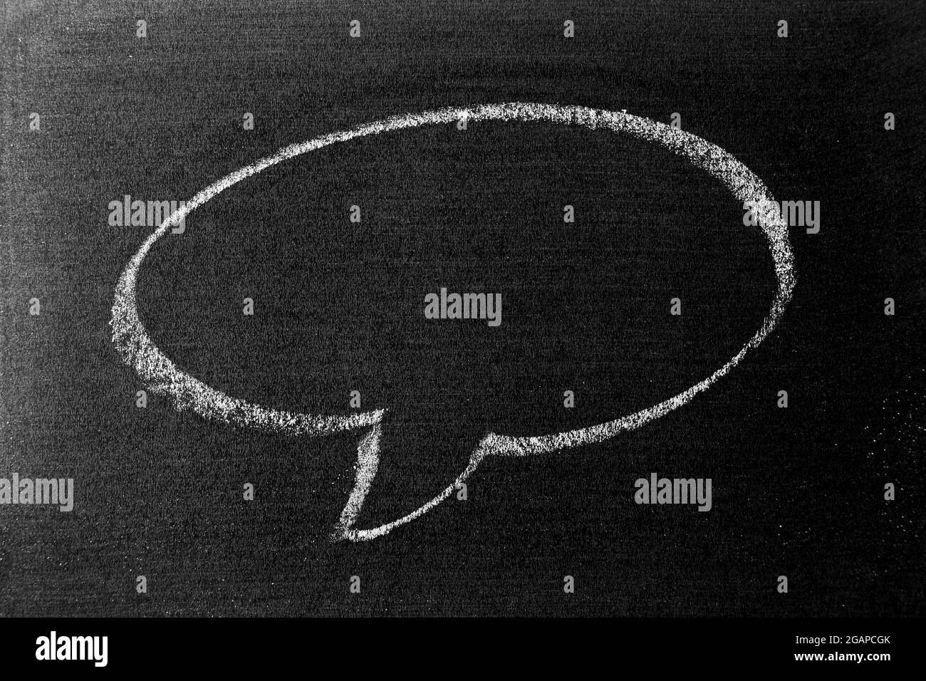 White color chalk hand drawing in round bubble speech shape with blank ...