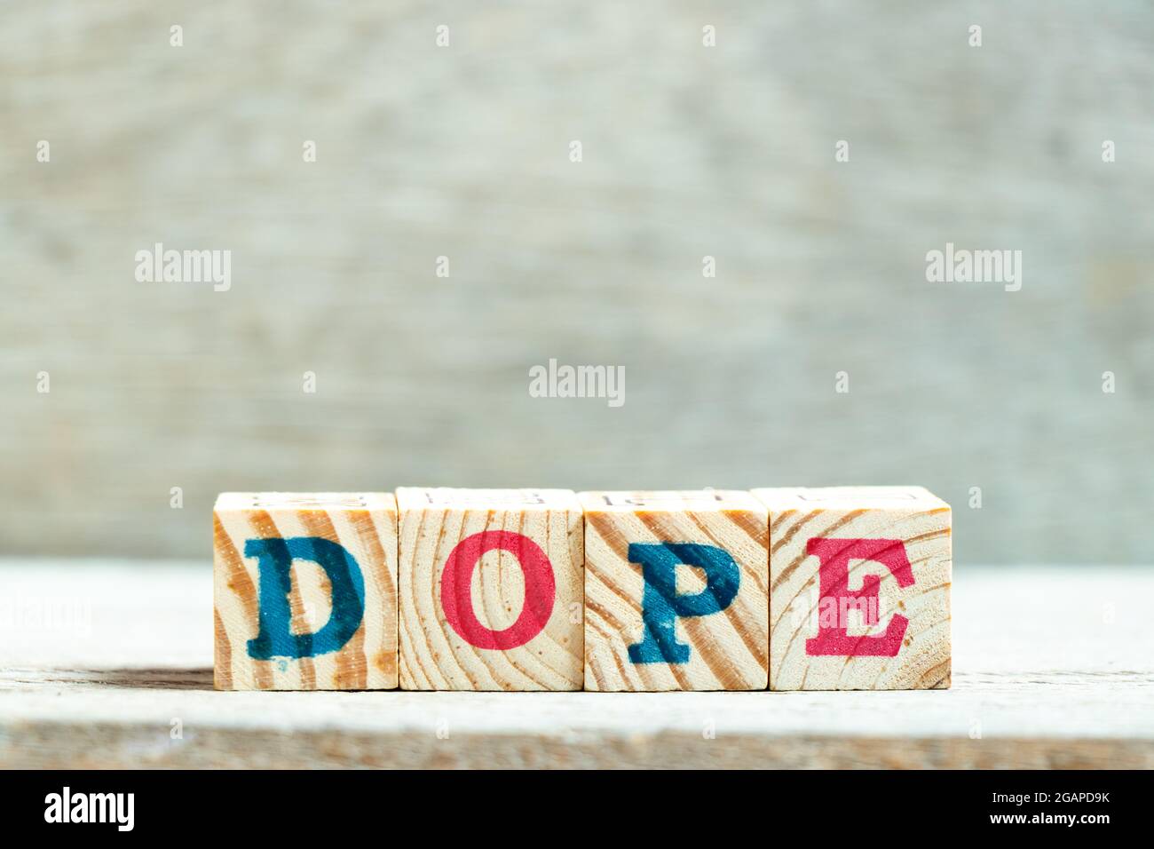 Alphabet letter block in word dope on wood background Stock Photo - Alamy