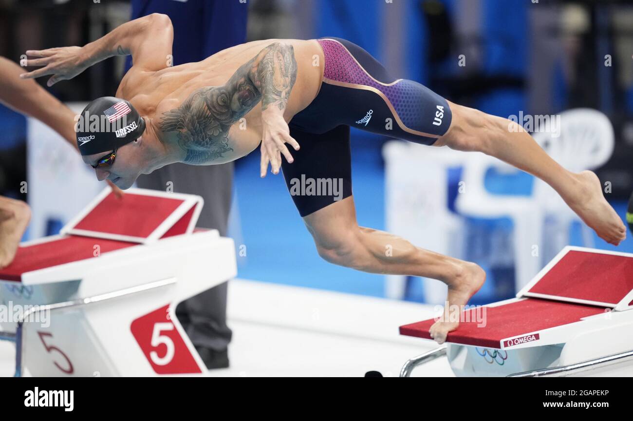 U.S. swimmer Caeleb Dressel dives off the starting block in the men's ...
