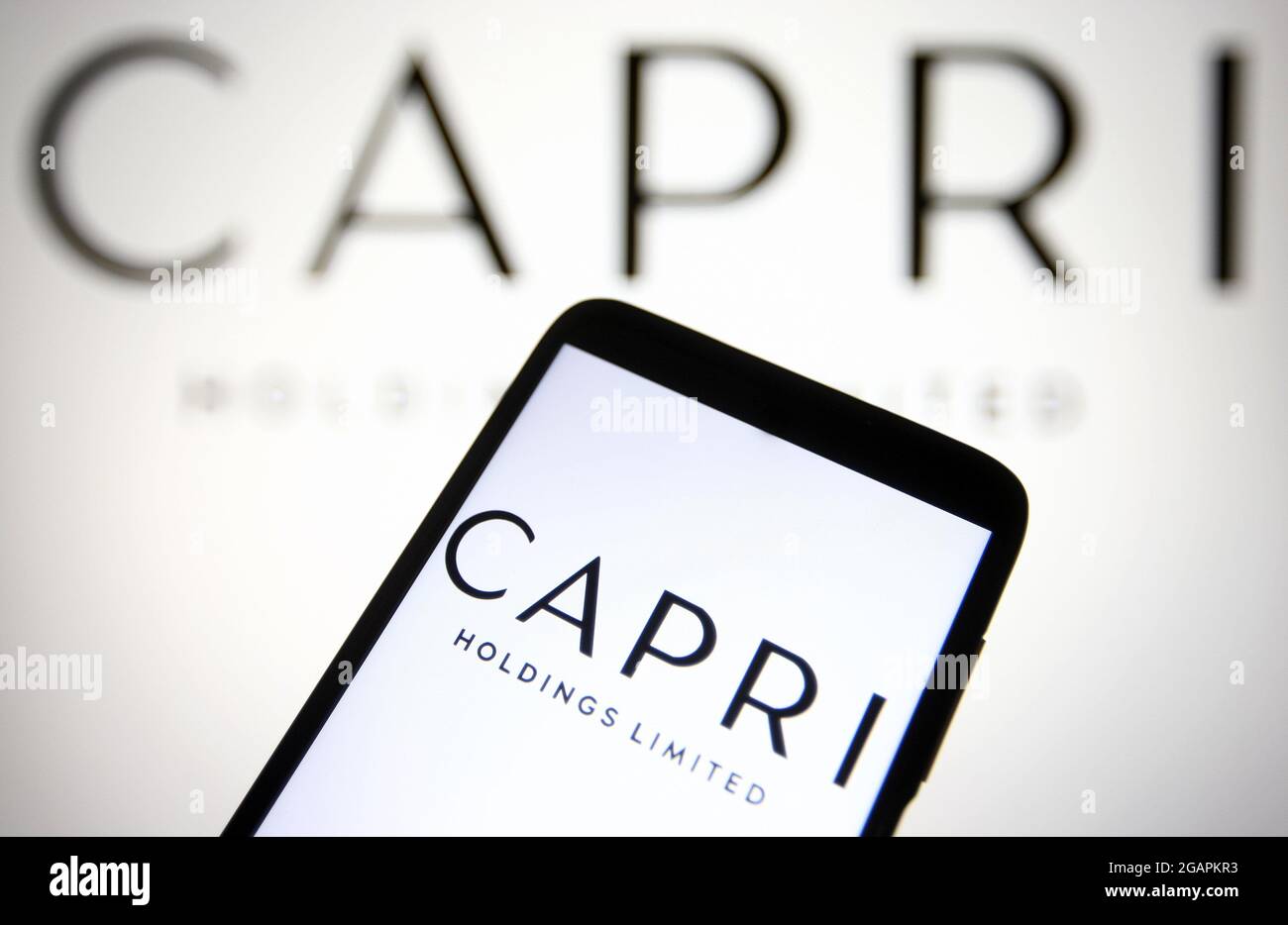 In this photo illustration, Capri Holdings Limited logo seen displayed ...