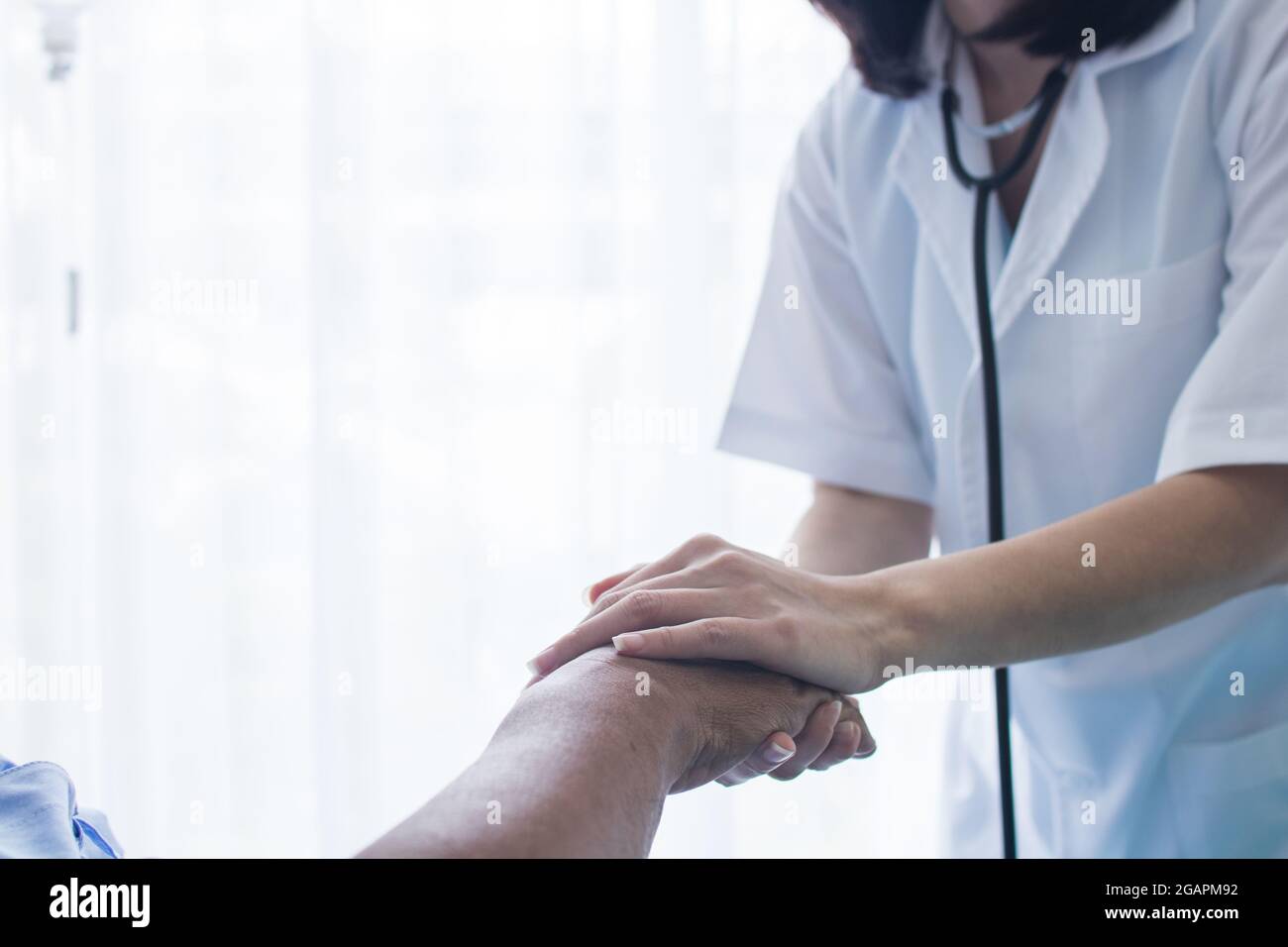 Caring female doctor hi-res stock photography and images - Alamy