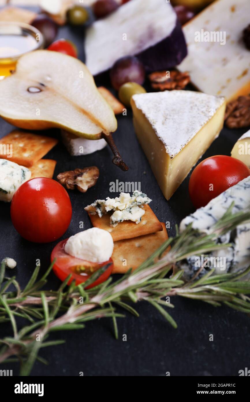 Different kinds of cheese closeup Stock Photo - Alamy