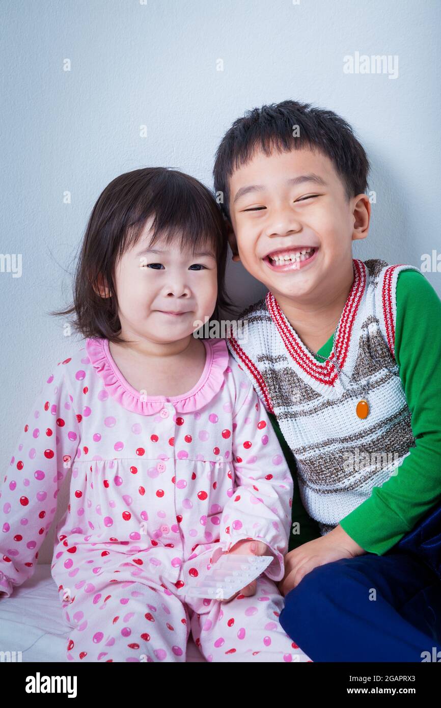 Little asian (thai) children happily, brother and sister smiling ...