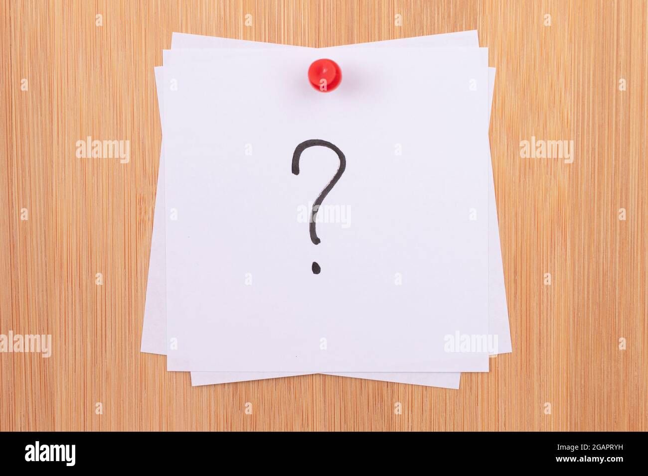 White Sticky Notes with Question Mark Pinned to the Wooden Message ...