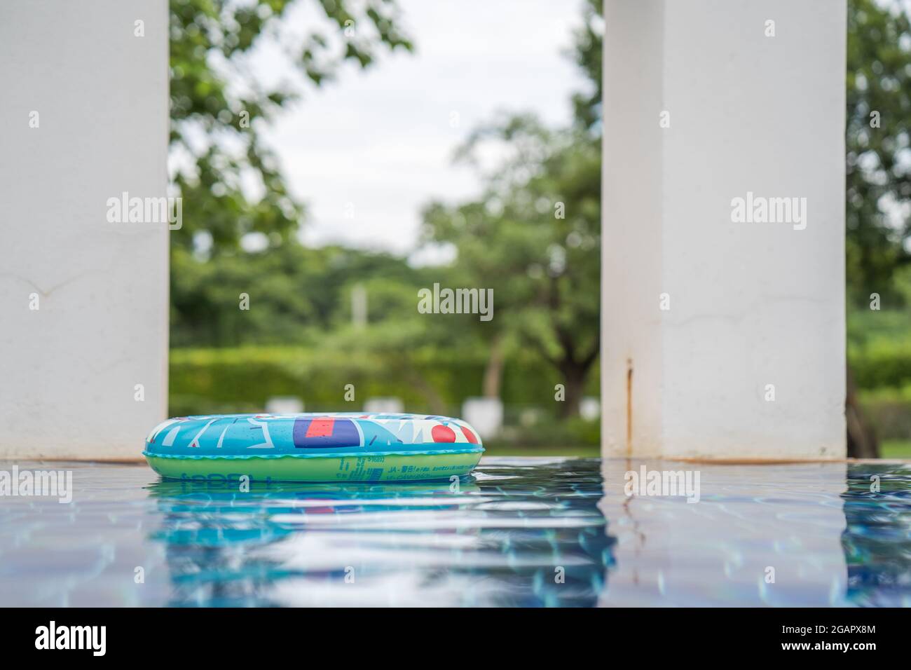 A blue ring floater on a swimming pool Stock Photo - Alamy