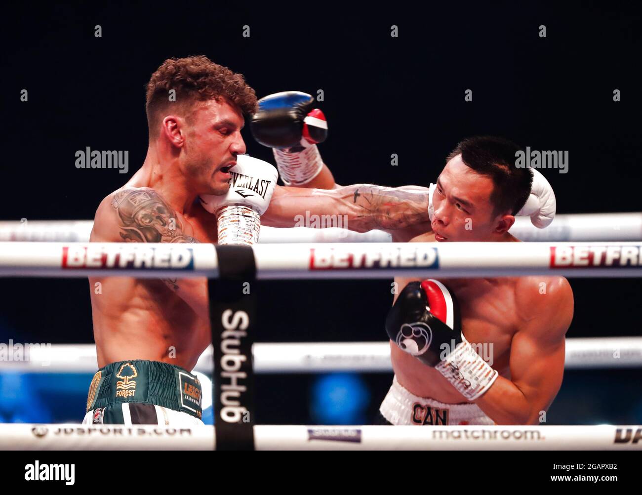 Brentwood, UK. 31st July, 2021. China's boxer Xu Can (R) competes ...