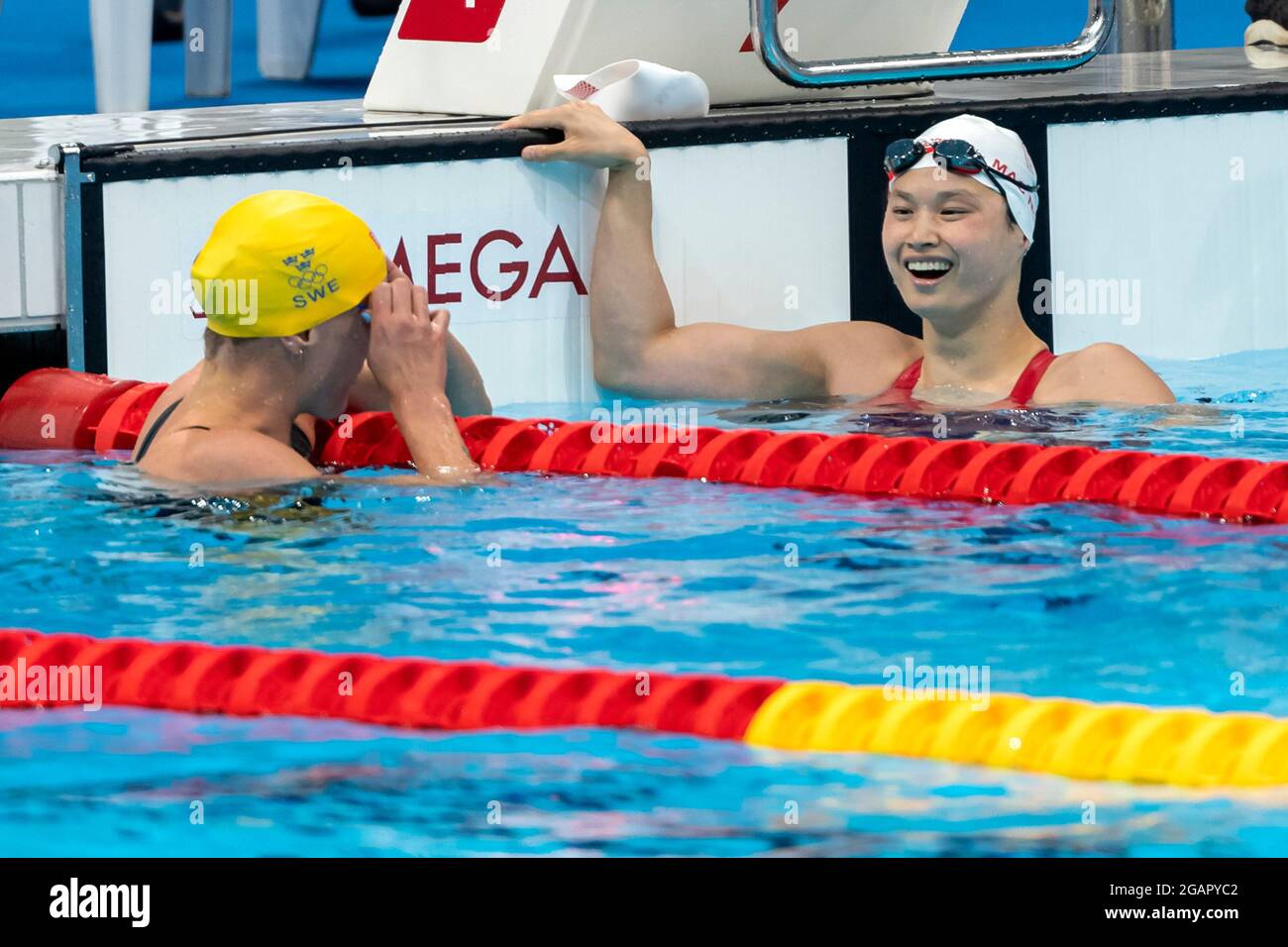 TOKYO, JAPAN - JULY 26: Margaret Macneil of Canada (r) celebrates with ...