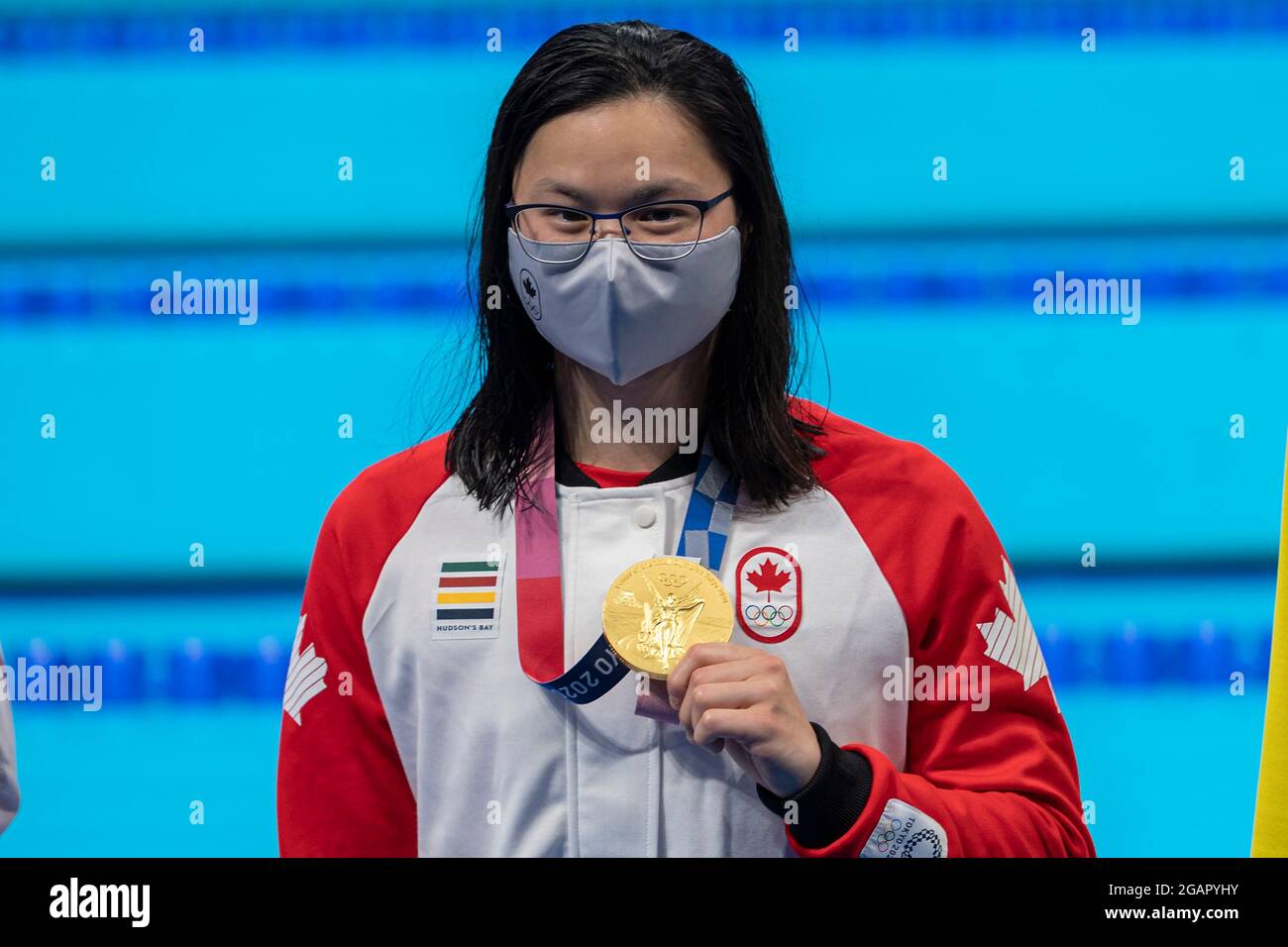 TOKYO, JAPAN - JULY 26: Margaret Macneil of Canada shows the gold medal ...