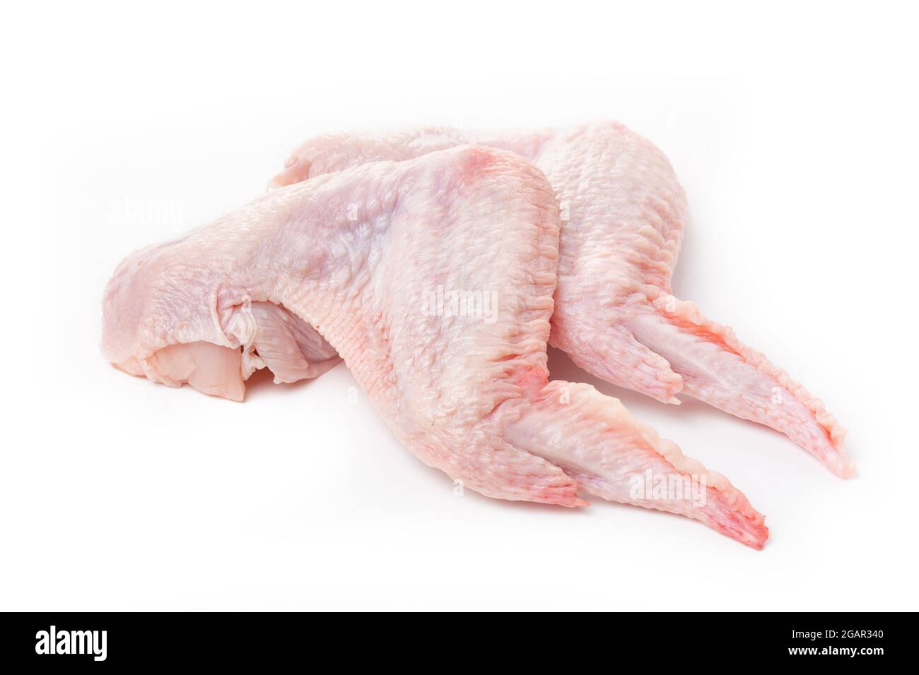 Raw chicken wings with skin on a white background Stock Photo - Alamy