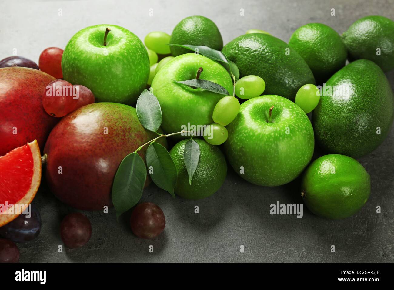 Fruits on dark grey background Stock Photo - Alamy