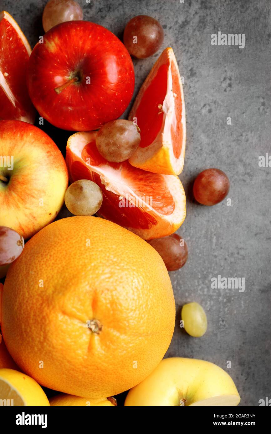 Fruits on grey background Stock Photo - Alamy