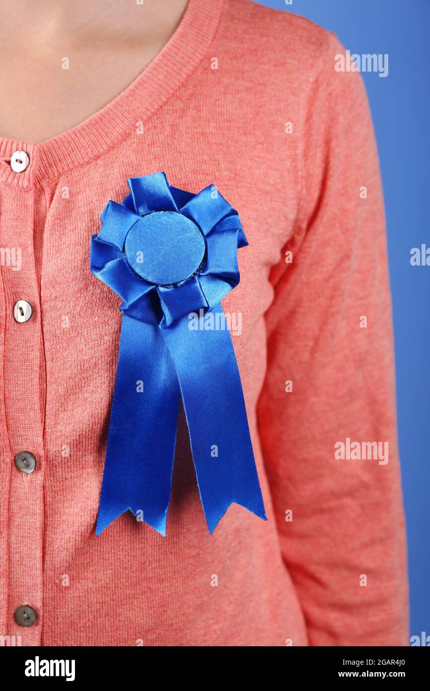 Woman with award ribbon. close-up Stock Photo - Alamy