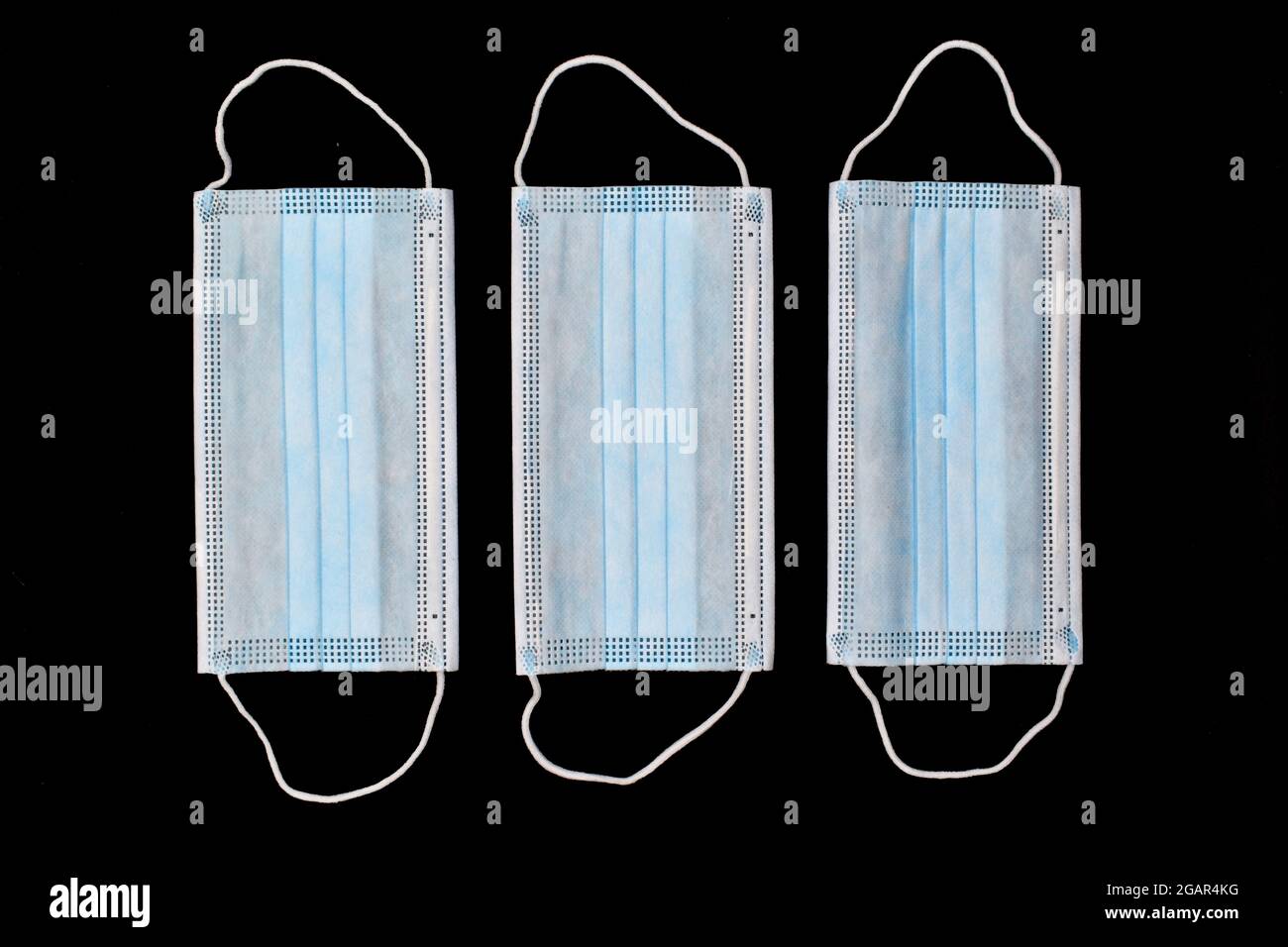 Disposable surgical masks or blue colored new medical respirators ...