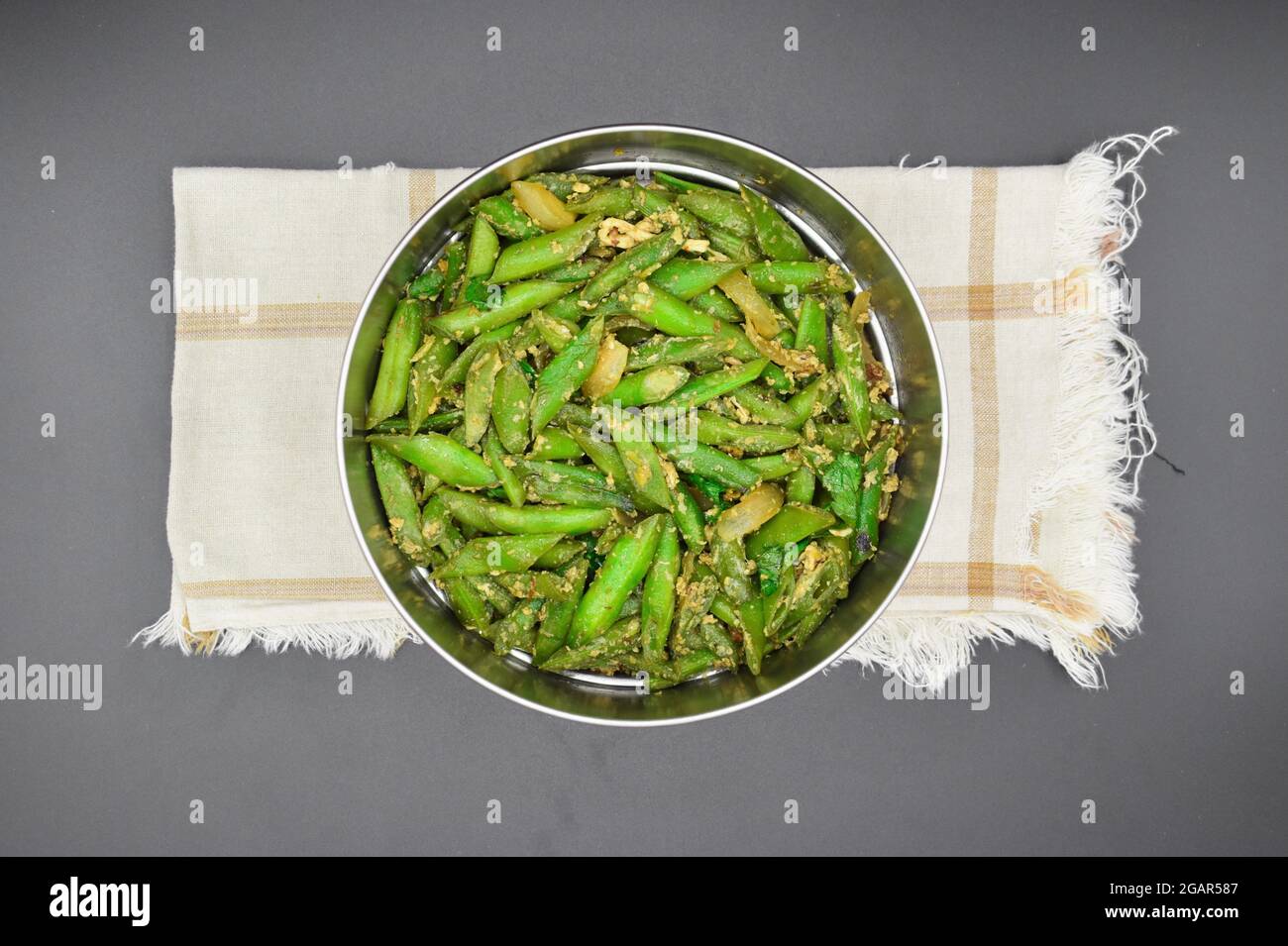 Asian, Myanmar or Burmese green bean curry recipe on napkin. Top view ...