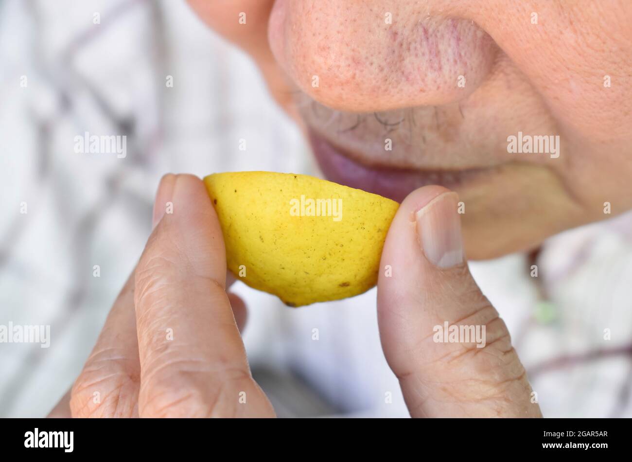 Old man smells hi-res stock photography and images - Alamy