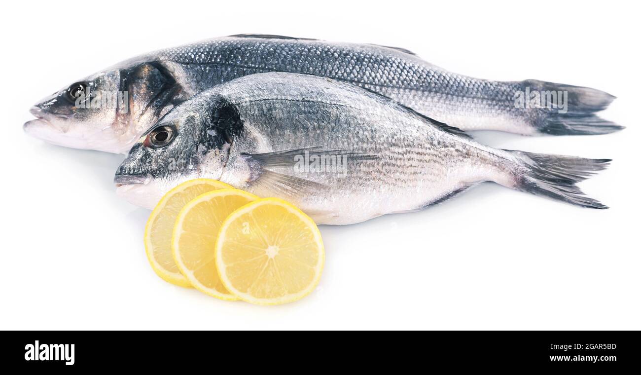 Fresh fish with lemon isolated on white background Stock Photo - Alamy