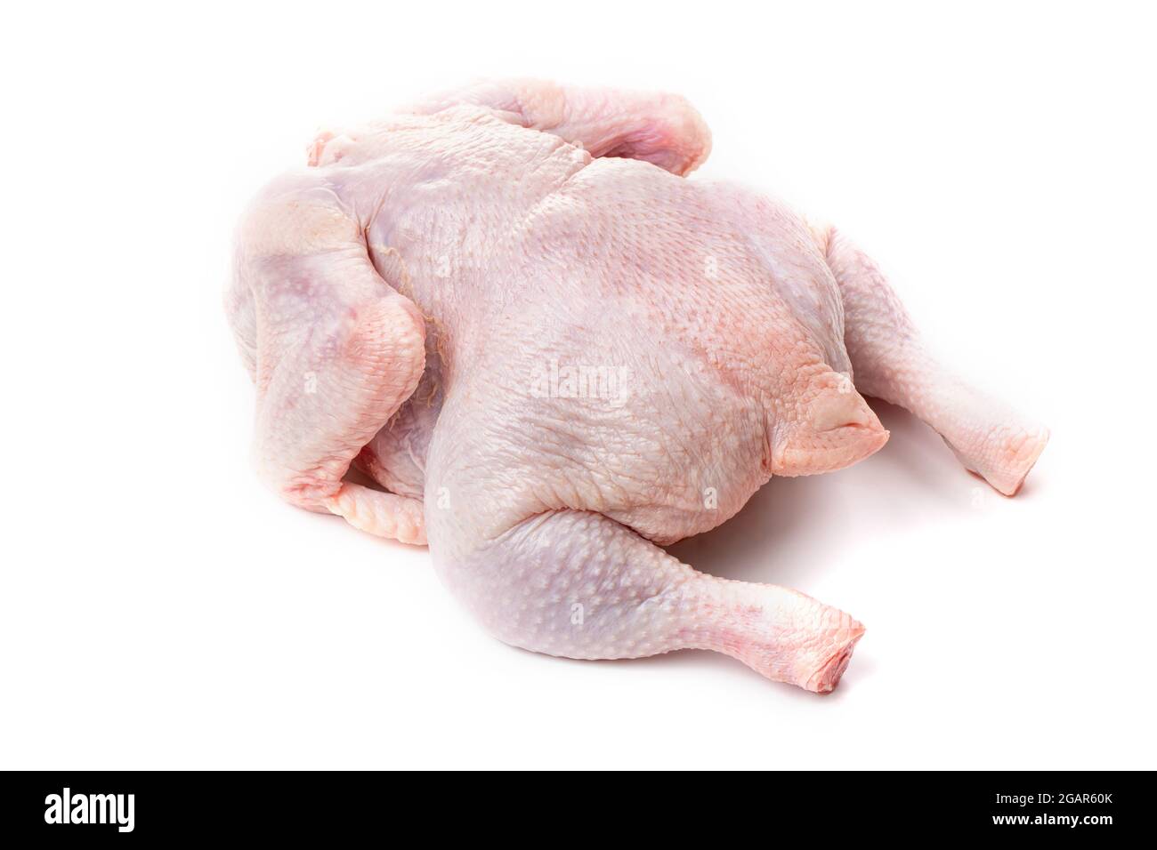 A whole chicken carcass on a white background Stock Photo - Alamy