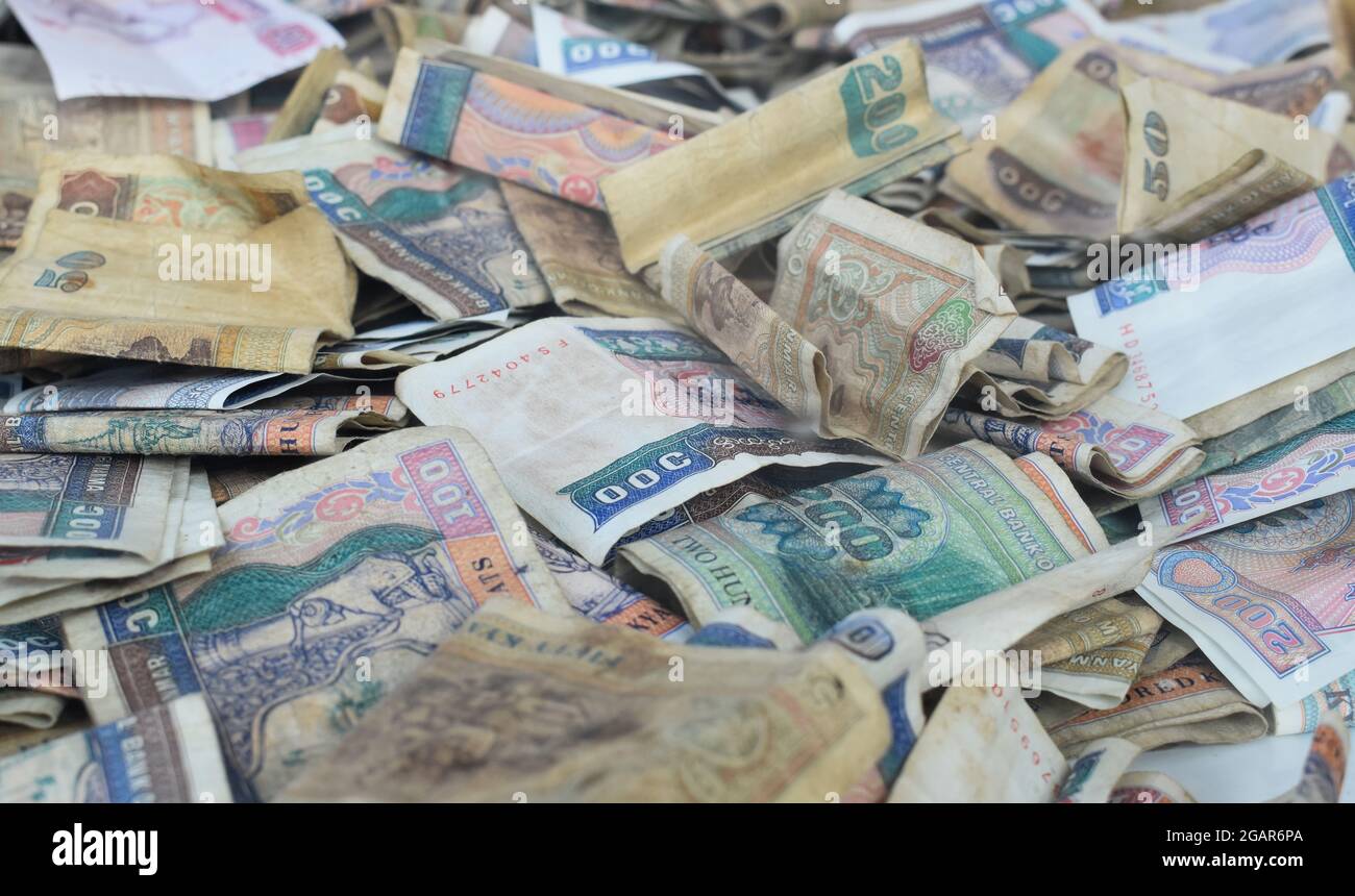 Heap of old Myanmar money. Stacks of Burmese banknotes. Burma currency ...