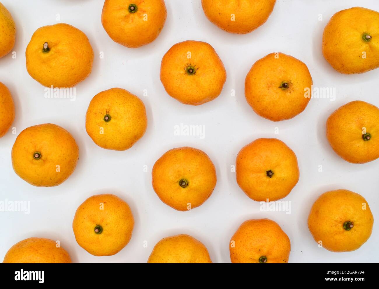 Mandarin oranges scattered. Isolated on white background. Top view ...
