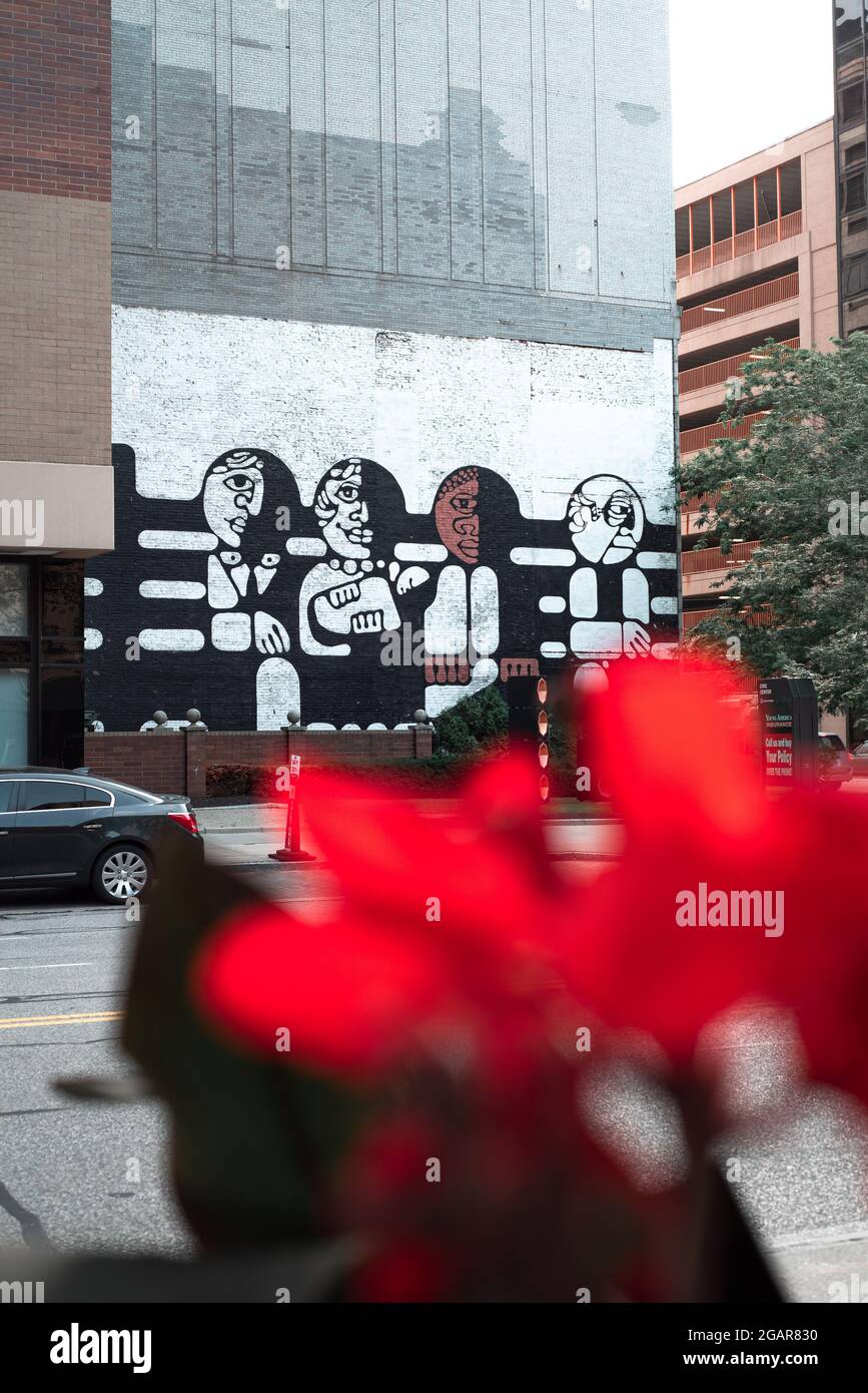 Life in Sharing the same park bench mural Stock Photo - Alamy