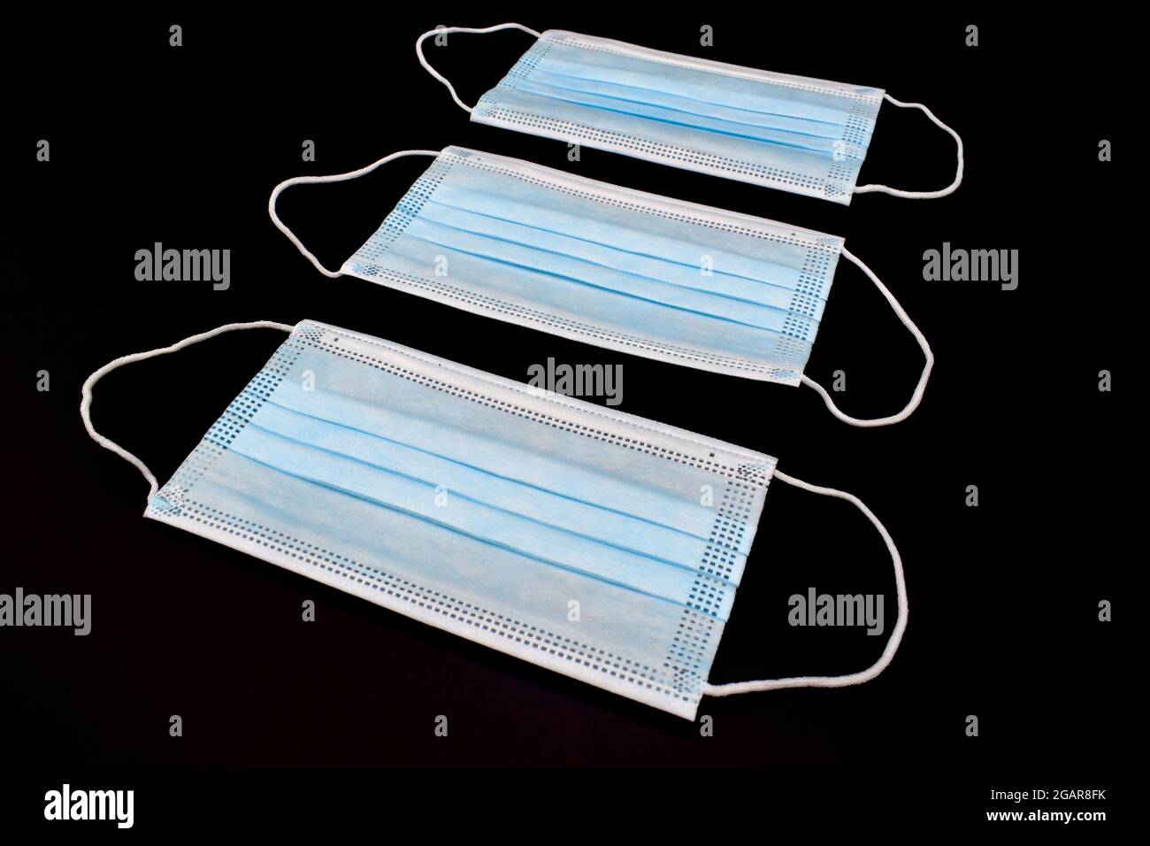 Disposable surgical masks or blue colored new medical respirators ...