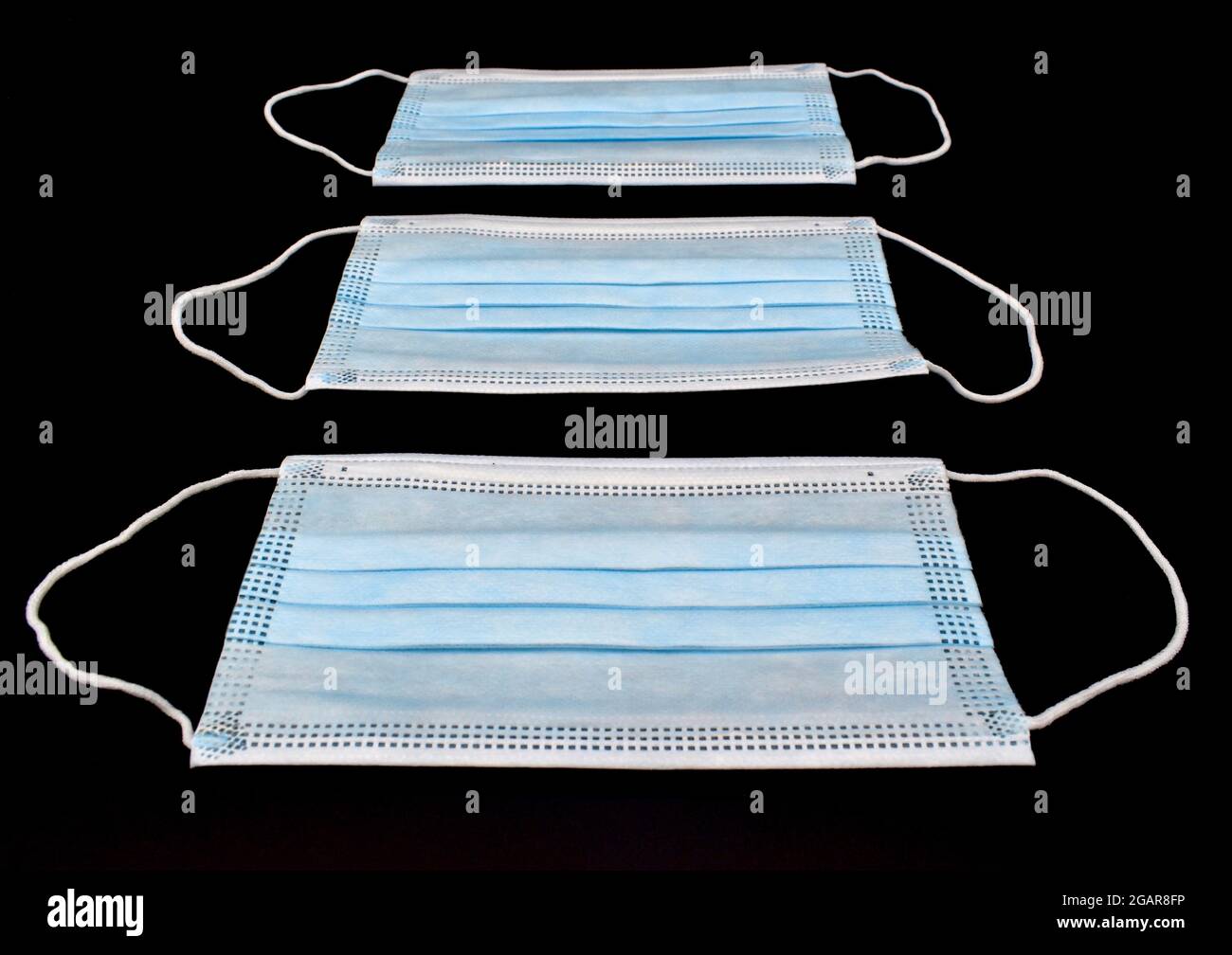 Disposable surgical masks or blue colored new medical respirators ...