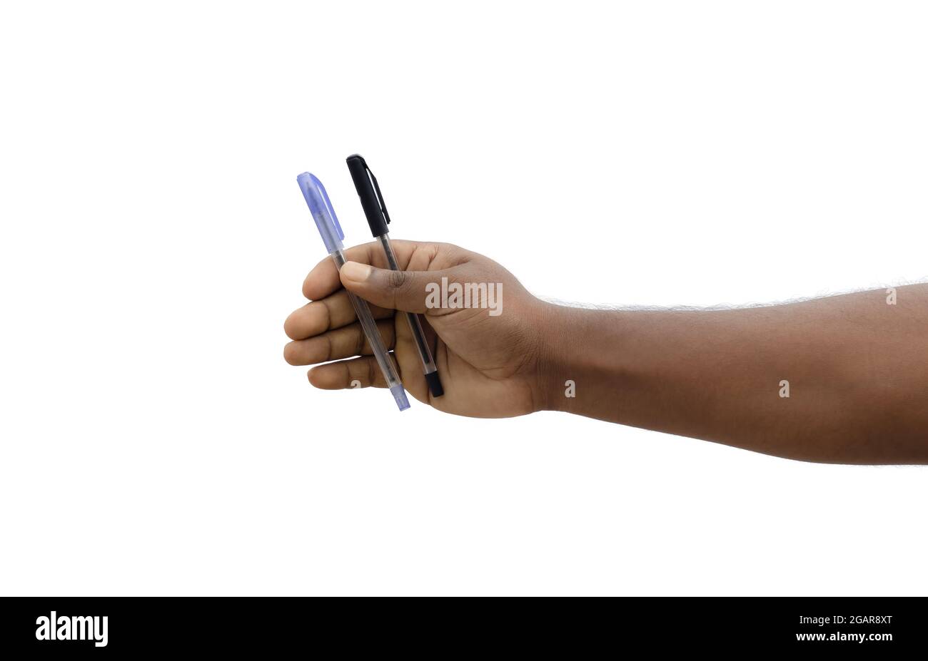 Two fountain pens holding on fist on isolated white background Stock ...