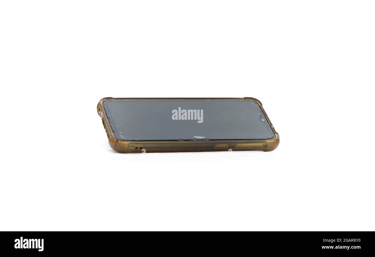 Used old smartphone with cracked screen protector on isolated white ...