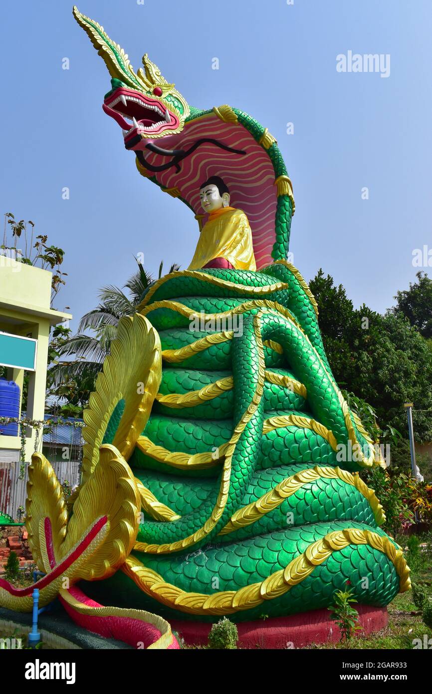 Myanmar Buddha statue on the two Burmese green dragons Stock Photo - Alamy