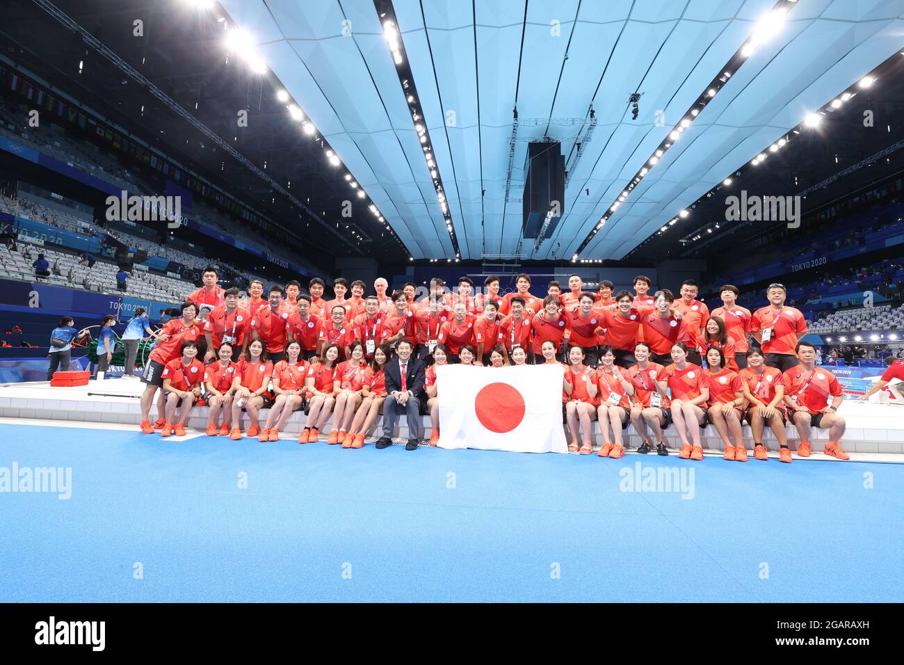 Japan's Swimming team member and coaches pose during the Tokyo 2020 ...