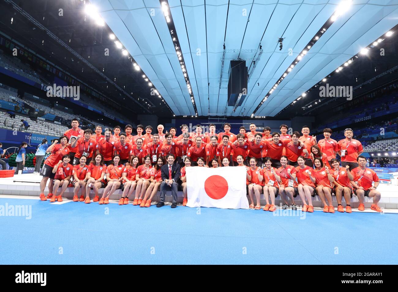 Japan's Swimming team member and coaches pose during the Tokyo 2020 ...