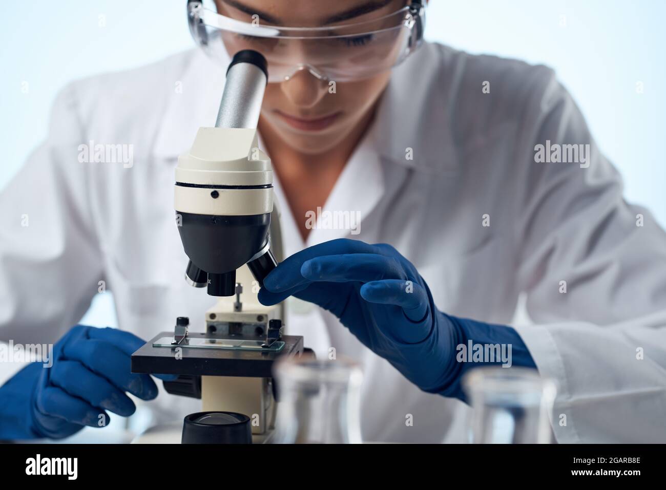 female doctor laboratory microscope study closeup Stock Photo - Alamy