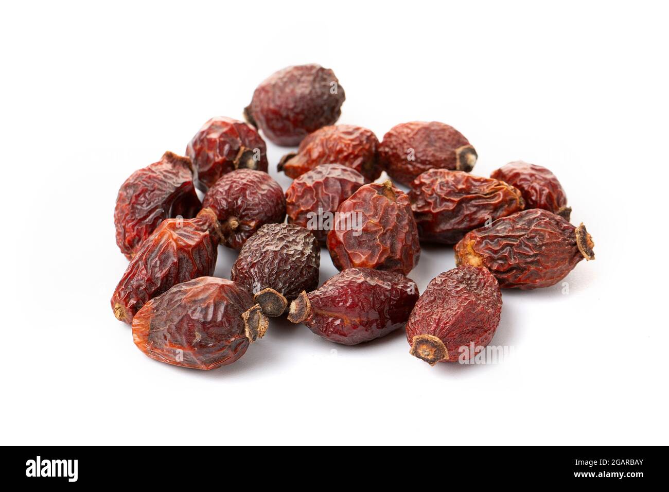 Dried rosehip berries, isolated on a white background Stock Photo - Alamy