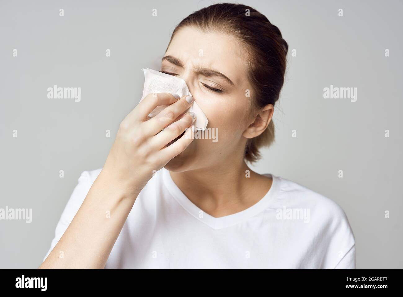 woman in white t-shirt handkerchief cold health problems Stock Photo ...