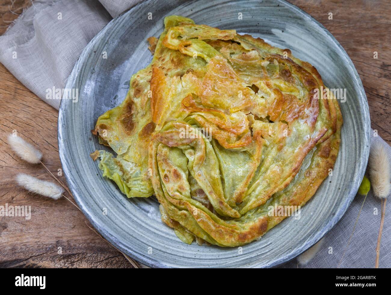 Homemade sweet frying roti (Thai Pancake) on ceramic plate. Delicious ...