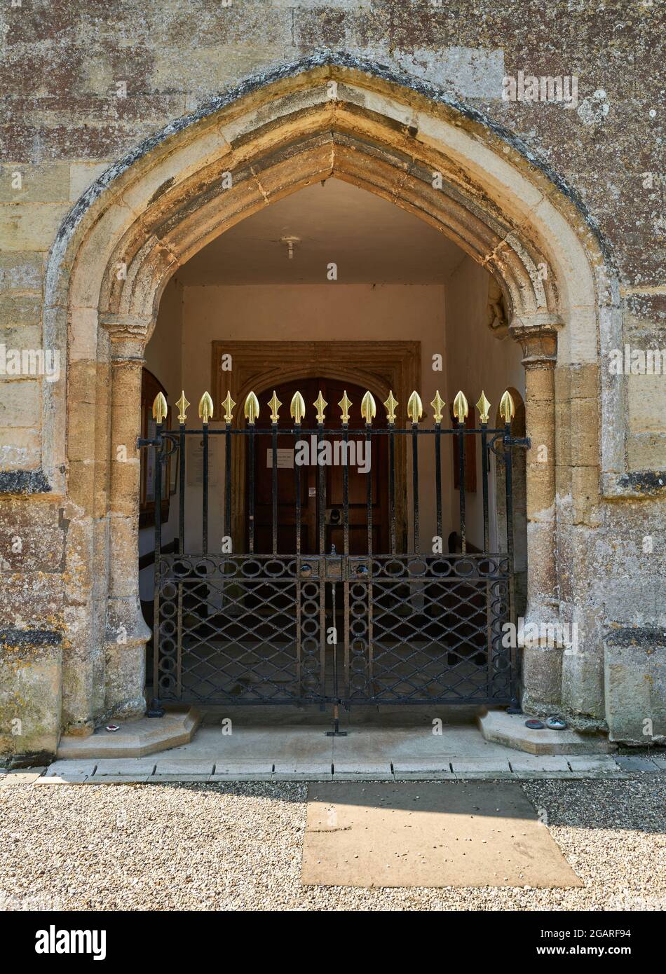 The arched entrance porch and gate of St Mary and All Saints 15th ...