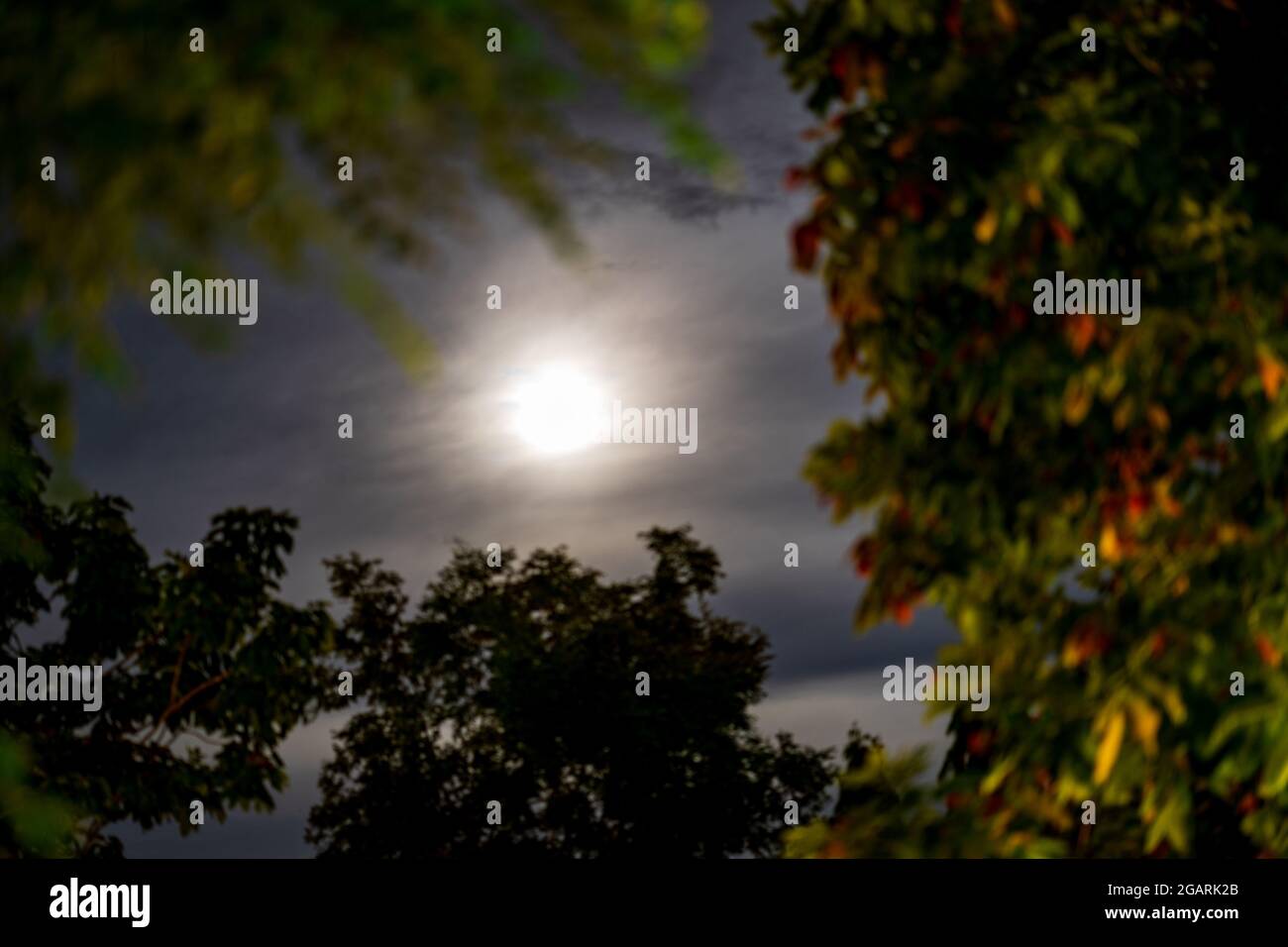 The beautiful scenery of full moon covered by clouds Stock Photo - Alamy
